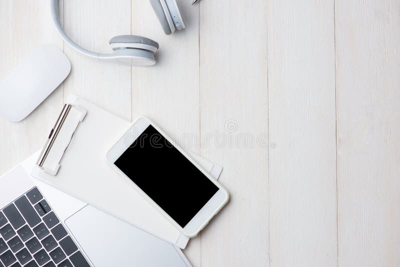 Laptop Computer on White Table with Headphone and Smartphone. Vi Stock ...