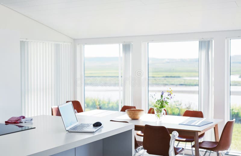 Laptop Computer on the White Table at Home on the Kitchen Stock Image ...