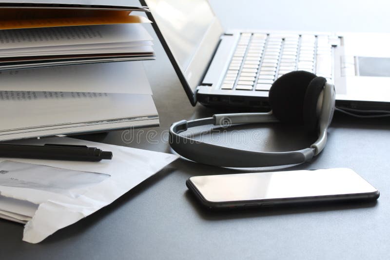 Laptop Computer on Working Table with Books, Papers, Pencil, Smartphone ...