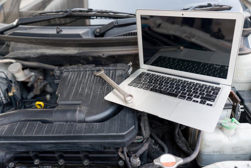 Laptop Computer and Wrench Tool Placing Inside Car S Hood on Car Engine ...
