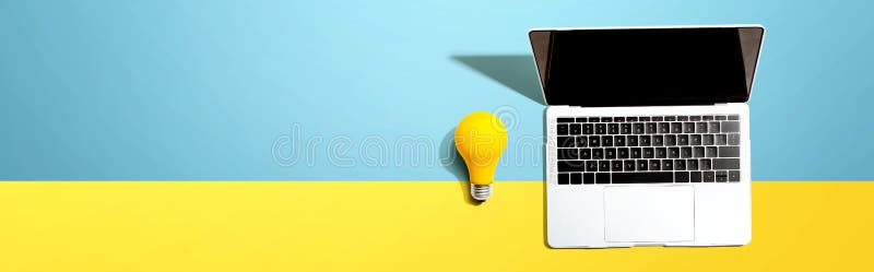 Laptop Computer with a Yellow Light Bulb Stock Photo - Image of ...