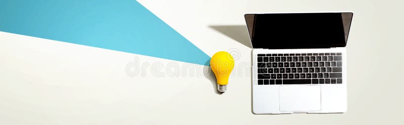 Laptop Computer with a Yellow Light Bulb Stock Image - Image of laptop ...