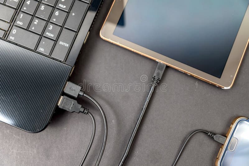 Laptop Connected To Digital Tablet Via Sata Usb Cable Closeup Overhead ...