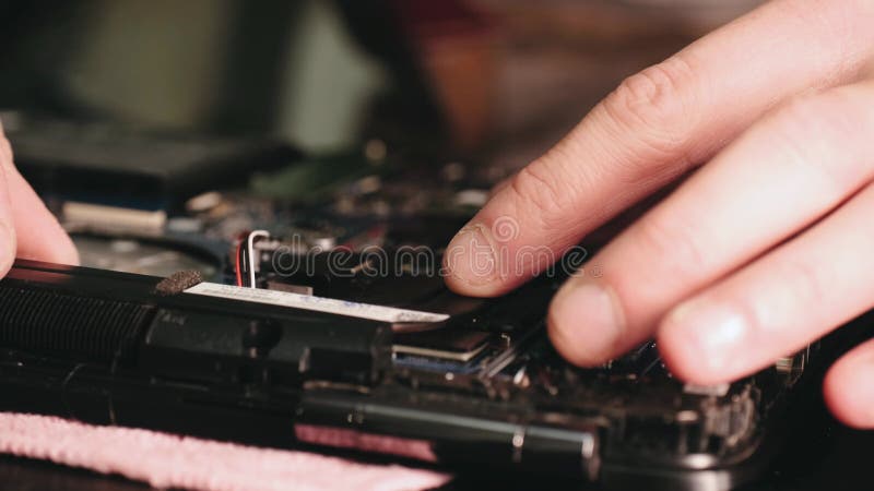 Laptop Cooling System Repair Disconnecting the Cable and Removing the ...