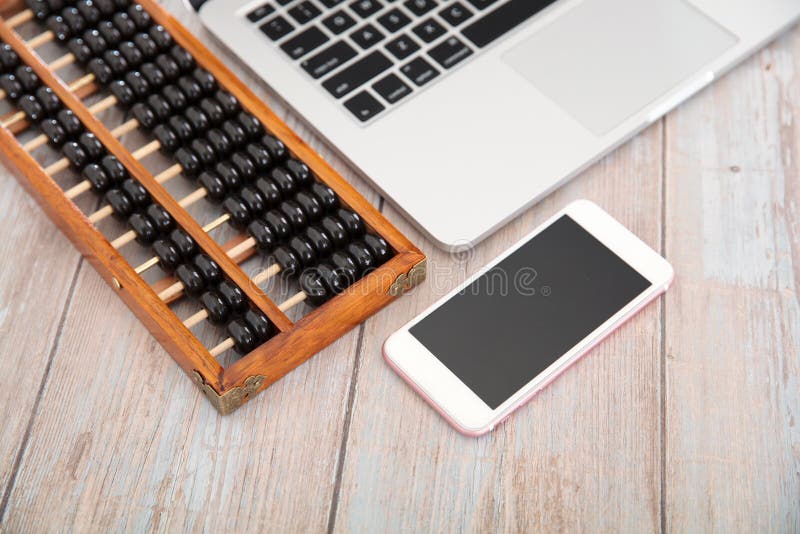 The Laptop on the Desk, the Mobile Phone beside it and the Traditional ...