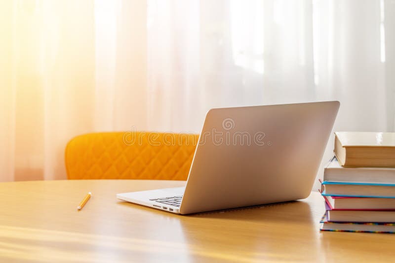 Laptop on a Desk with Stack of Books Stock Image - Image of energy ...
