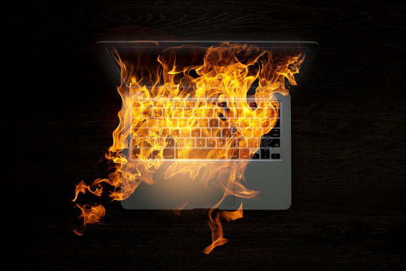 Laptop in fire flames stock image. Image of keyboard - 32884321