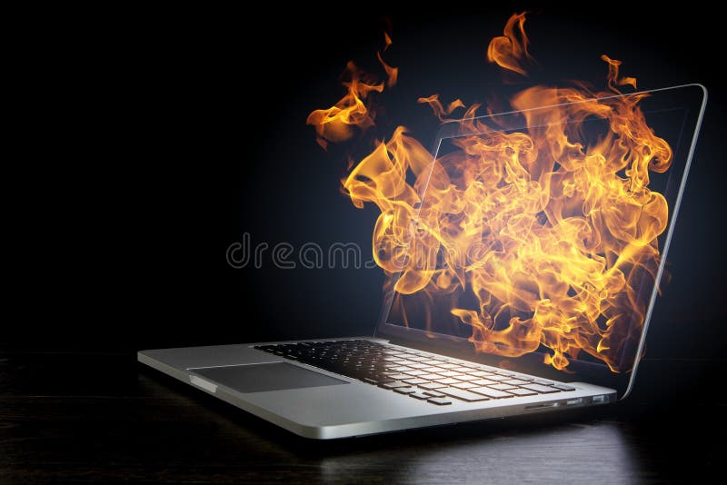 Laptop in fire flames stock image. Image of keyboard - 32884321