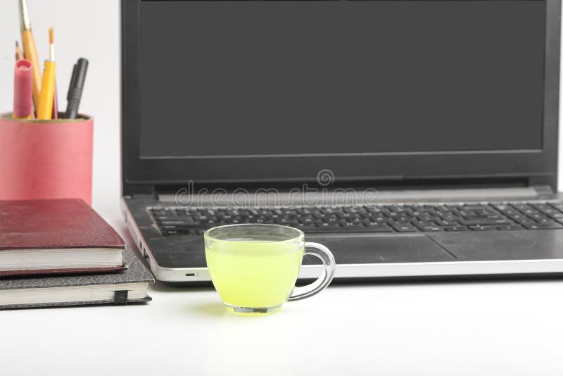 Laptop and Diary with Cup of Green Tea. Work from Home Concept Stock ...