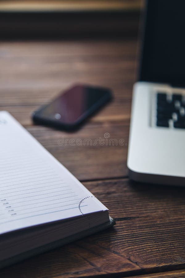 Laptop and Diary on the Desk Stock Image - Image of wooden, home: 57137523
