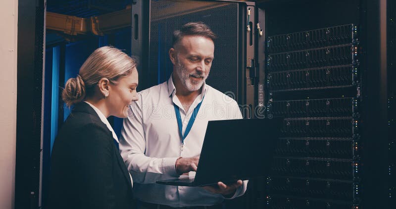 Laptop, Discussion and Team of Engineers in Server Room for Technical Support, Database or ...