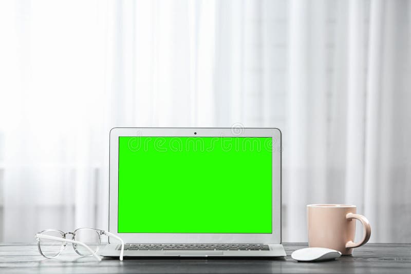Laptop Display with Chroma Key on Desk in Room. Comfortable Workplace ...