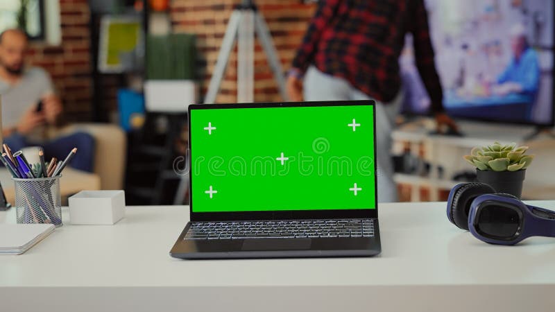 Laptop Display Showing Isolated Green Screen on Empty Table Stock Photo ...