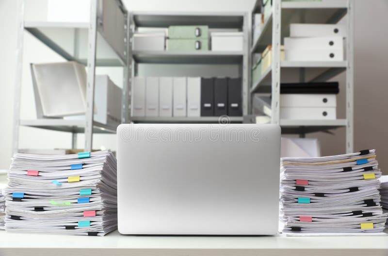 Laptop and Documents on Desk Stock Photo - Image of documentation ...