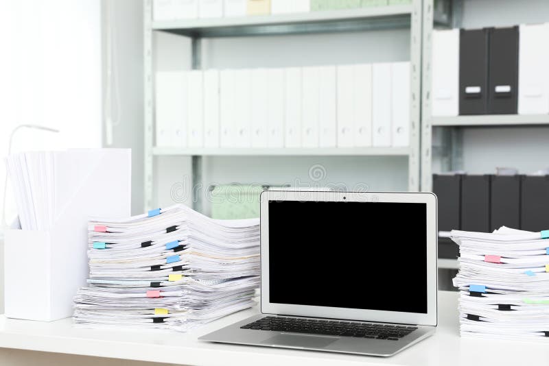 Laptop and Documents on Desk in Office Stock Photo - Image of paper ...
