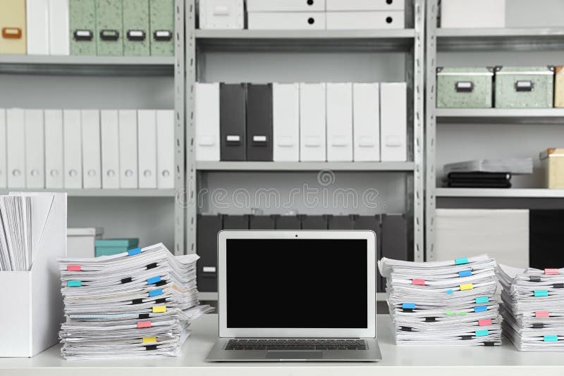 Laptop and Documents on Desk in Office Stock Photo - Image of papers ...