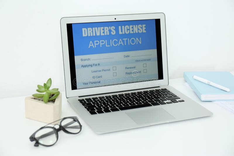 Laptop with Driver`s License Application Form on Table in Office Stock ...