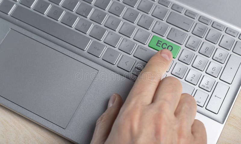 Laptop and Eco-friendly Technology Concept. Hand Pressing Green Button ...