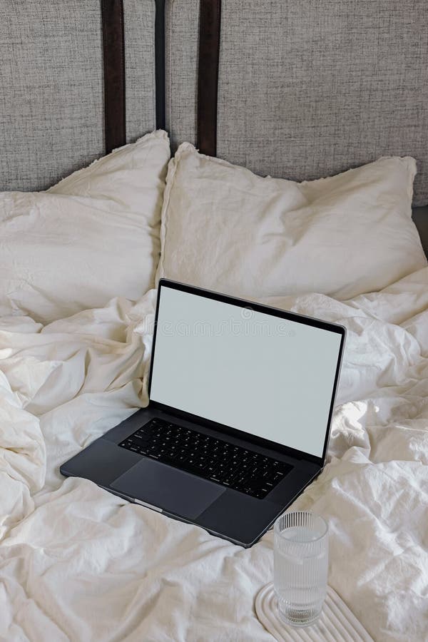 Laptop with Empty Screen on the Bed, Computer Mock-up Stock Image ...