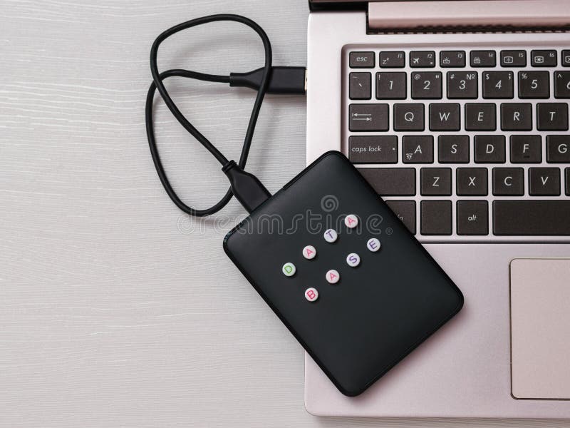 Laptop with External Hard Drive Labeled Database on the Table. Flat Lay ...