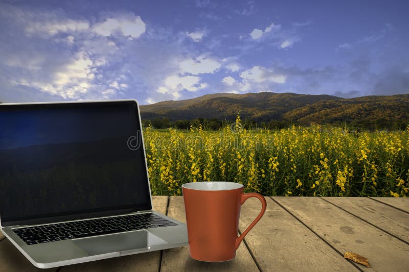 Laptop Front View and Coffee Cup with Notebooks on Wooden Table ...