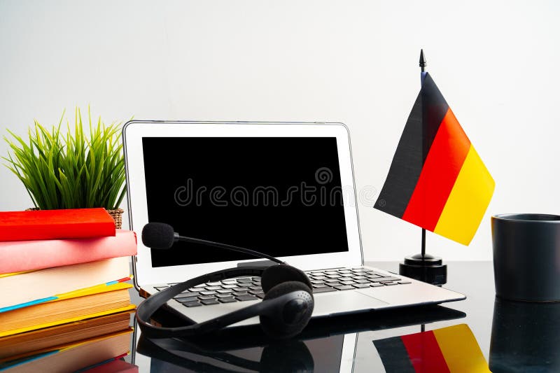 Laptop with German Flag on Working Table, Educational Concept Stock ...