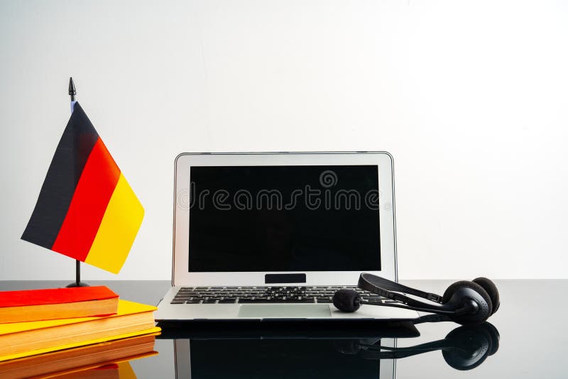 Laptop with German Flag on Working Table, Educational Concept Stock ...
