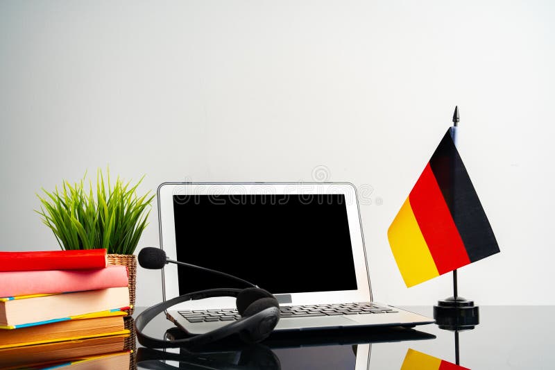 Laptop with German Flag on Working Table, Educational Concept Stock ...