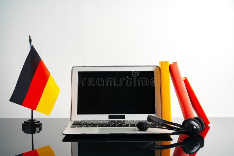Laptop with German Flag on Working Table, Educational Concept Stock ...