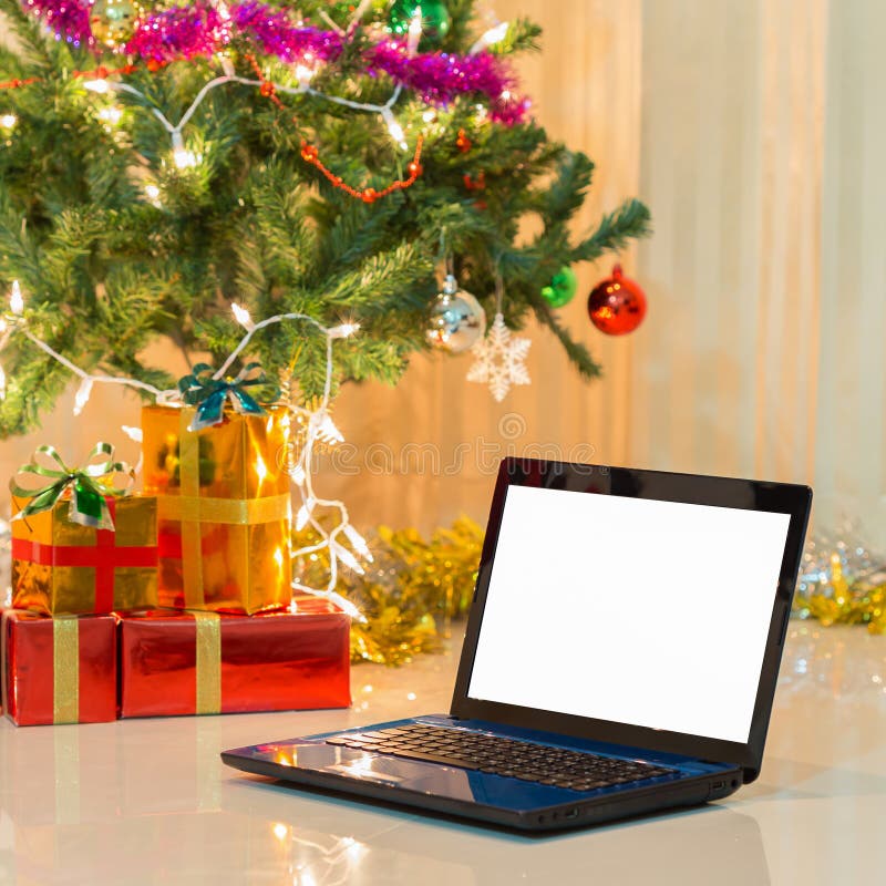 Laptop with Gift Box and Christmas Lights Stock Image - Image of ...