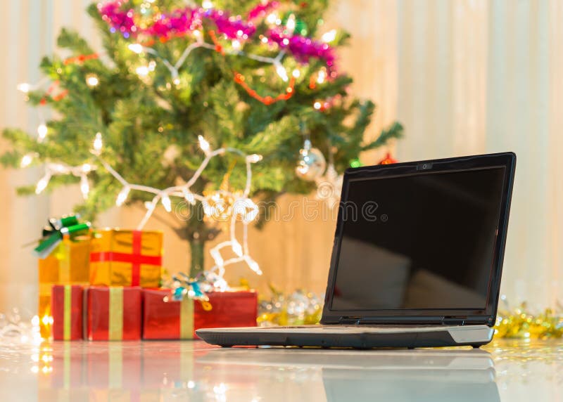 Laptop with Gift Box and Christmas Lights Stock Image - Image of ...