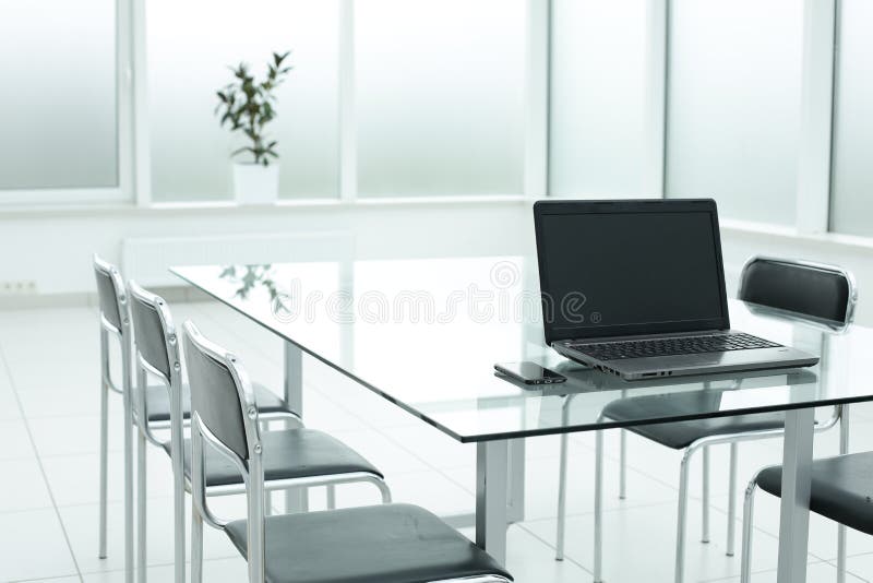 Laptop on Glass Table in Spacious Office Space Stock Photo - Image of ...