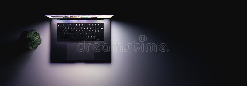 Laptop with a Glowing Screen on a Table in the Dark, Top View, Copy ...