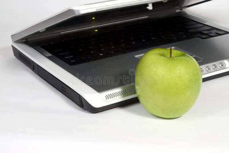 Laptop and green apple stock image. Image of school, office - 4326391