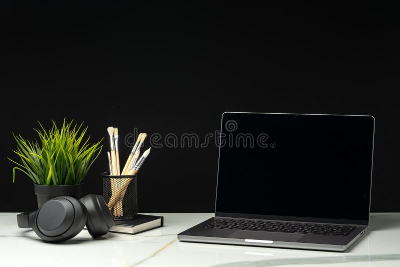 Laptop with Green Leafy Potted Plant on Black Background Stock Photo ...