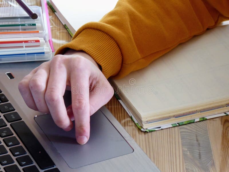 A Laptop with Hand and a Study Book. Stock Photo - Image of device ...