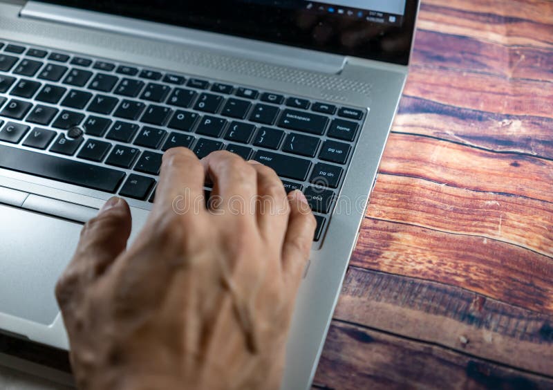Laptop with a Hand while Typing or Encoding. Business Concept, Office ...