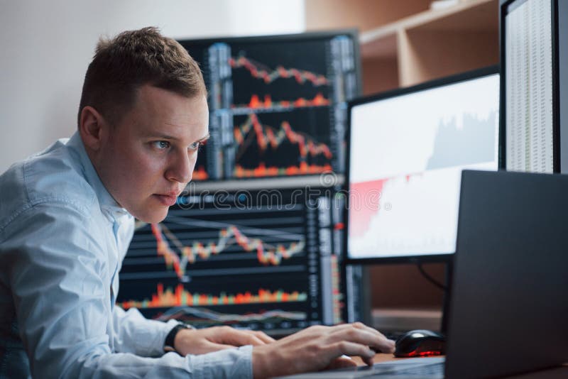 Laptop for daily Job. Man Working Online in the Office with Multiple ...