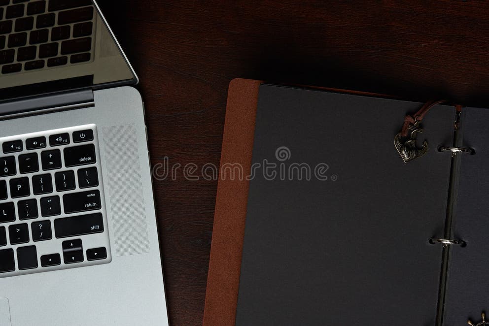 Laptop with Journal on Wooden Table Stock Photo - Image of office ...