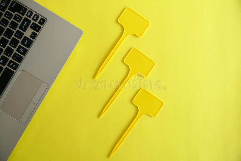 Laptop Keyboard and Empty Yellow Labels Isolated on Yellow Background ...