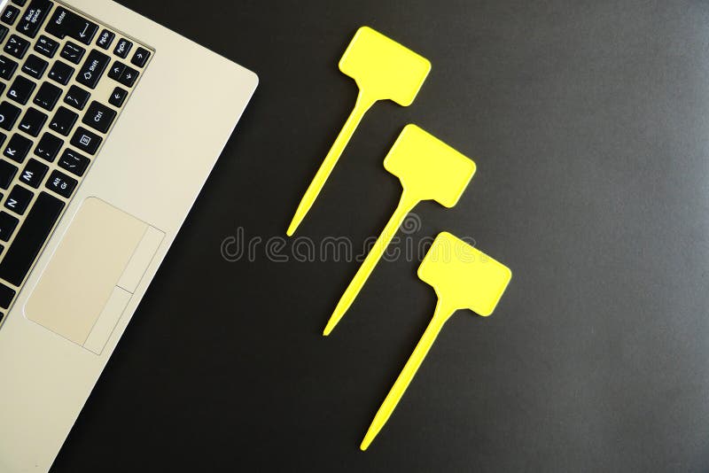 Laptop Keyboard and Empty Yellow Labels on Black Background Stock Photo ...