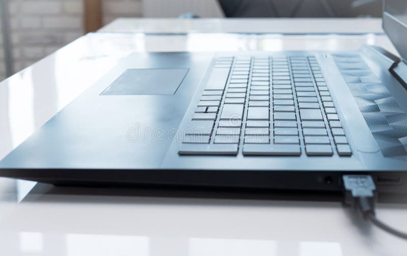 Laptop Keyboard on the Table. Black Laptop with Usb Cable Stock Image ...