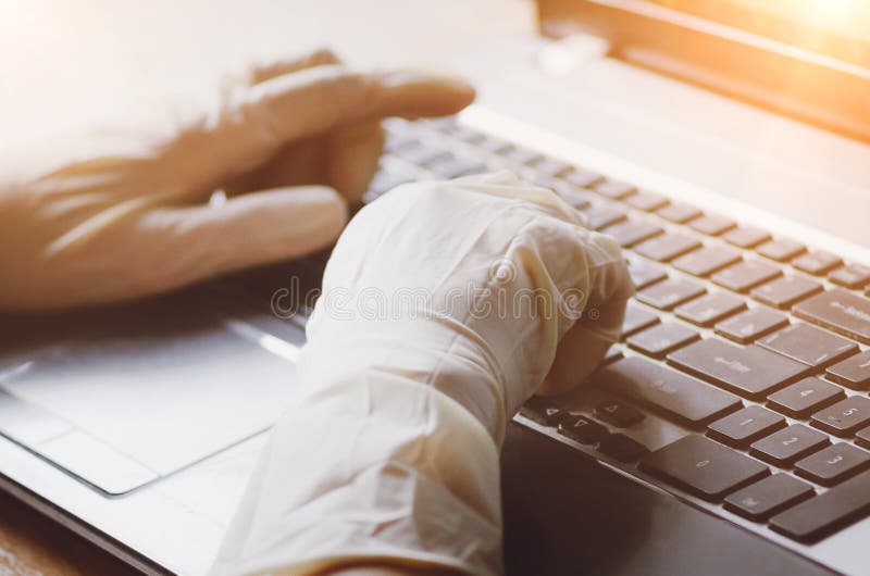 Laptop Keyboard. Work at the Computer in Gloves for Protection Against ...