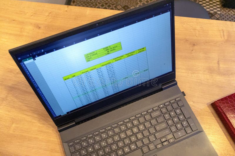 Laptop on the Kitchen Counter Top with an Excel Sheet on Computer ...
