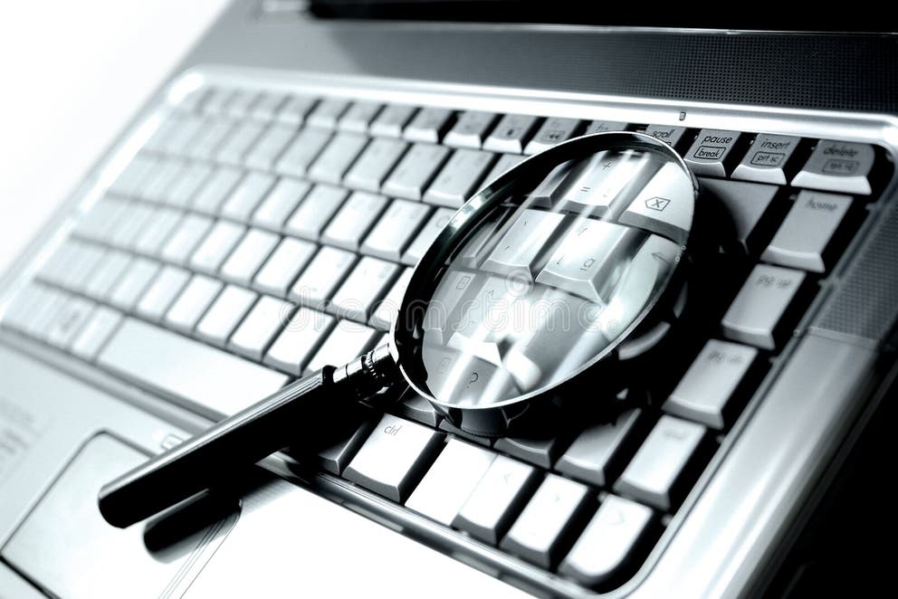 Laptop + Magnifying Glass stock photo. Image of search - 10910874