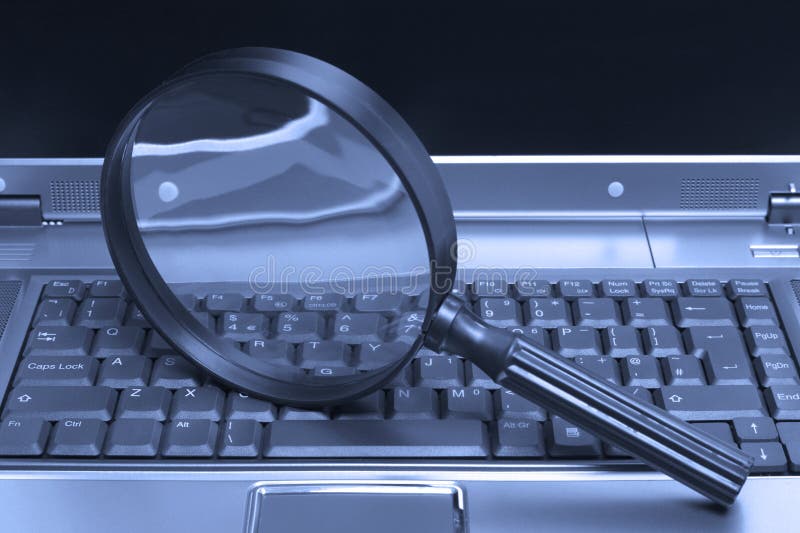 Laptop + Magnifying Glass stock photo. Image of search - 10910874
