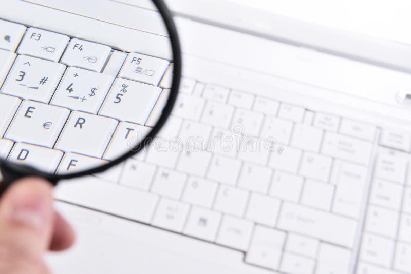 Laptop + Magnifying Glass stock photo. Image of search - 10910874