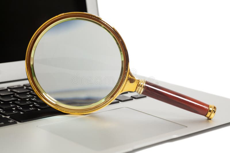 Laptop + Magnifying Glass stock photo. Image of search - 10910874