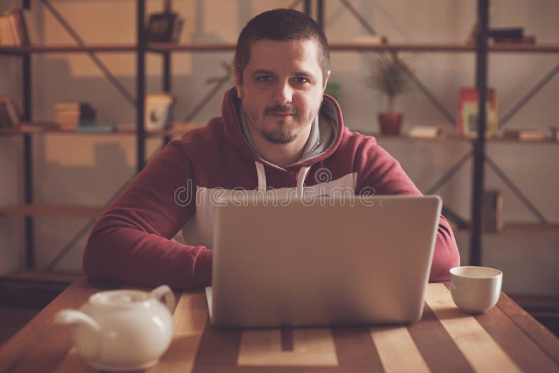 Laptop and man with hood stock image. Image of person - 82992627