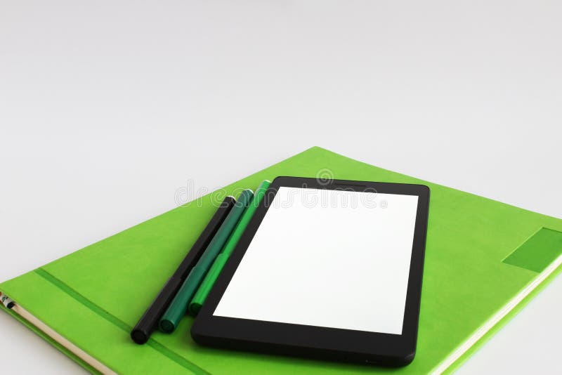 Laptop and Marker Pens are on the Green Weekly Stock Photo - Image of ...
